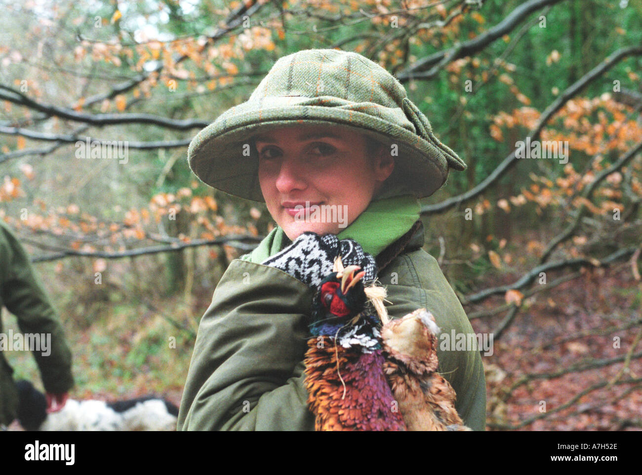 Lady carrying pheasant at The Ford shoot in the Cotswolds Stock Photo ...