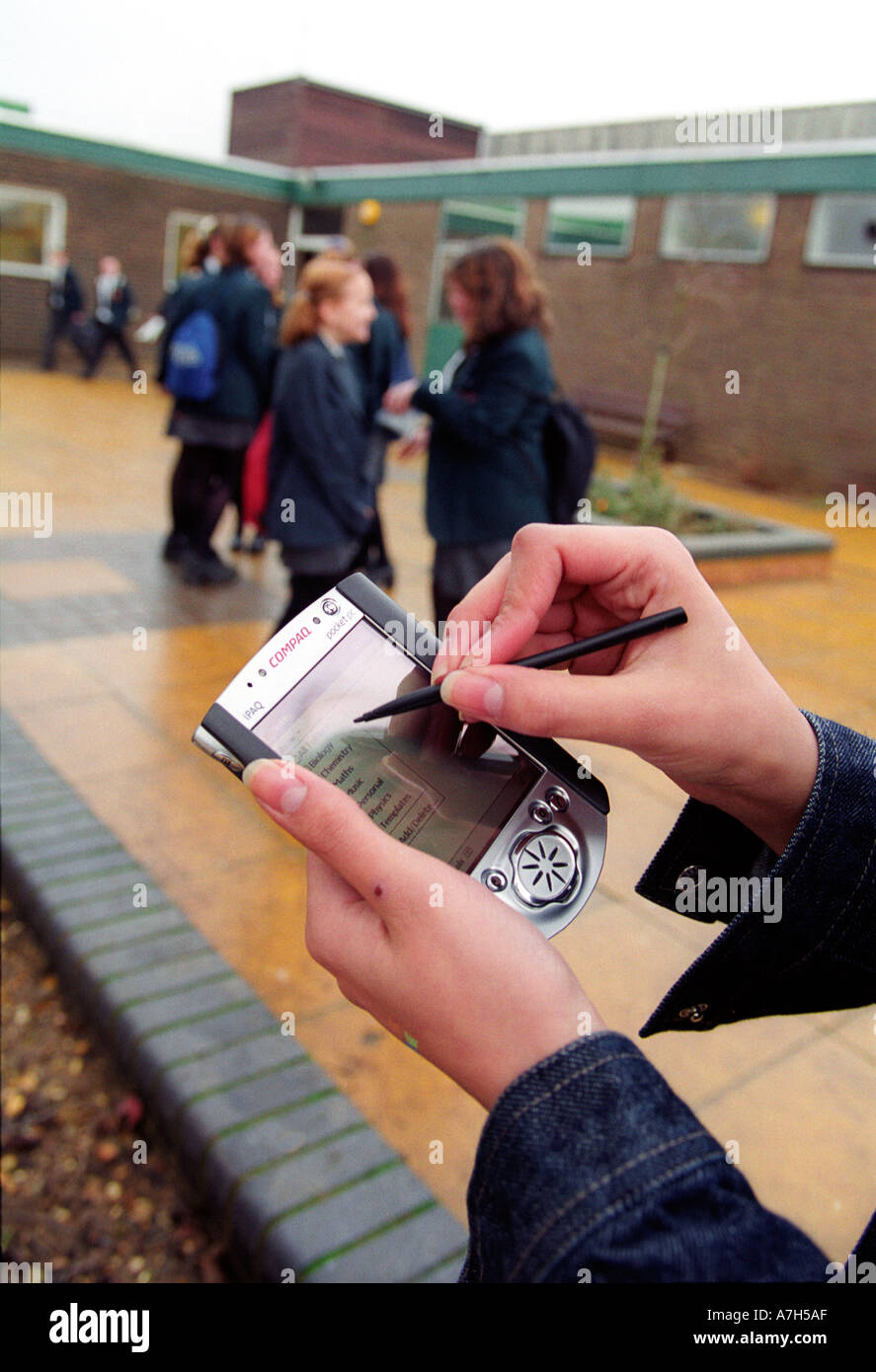 Sixth Form Students Using Handheld Personal Computers To Help With sixth-form-students-using-handheld-personal-computers-to-help-with