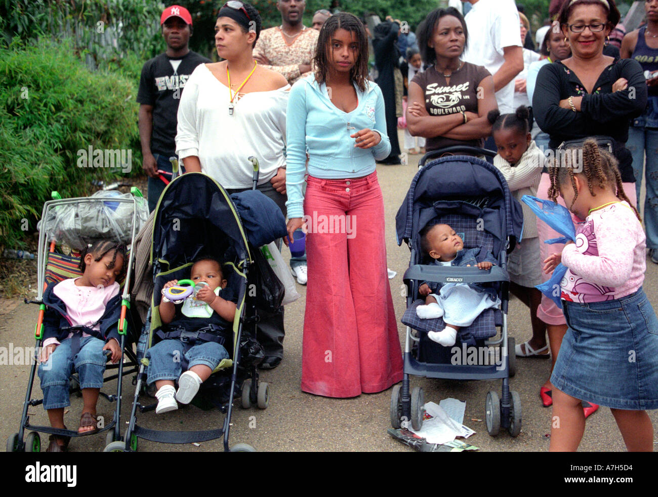 Racially mixed group of young people socialising in the streets of ...