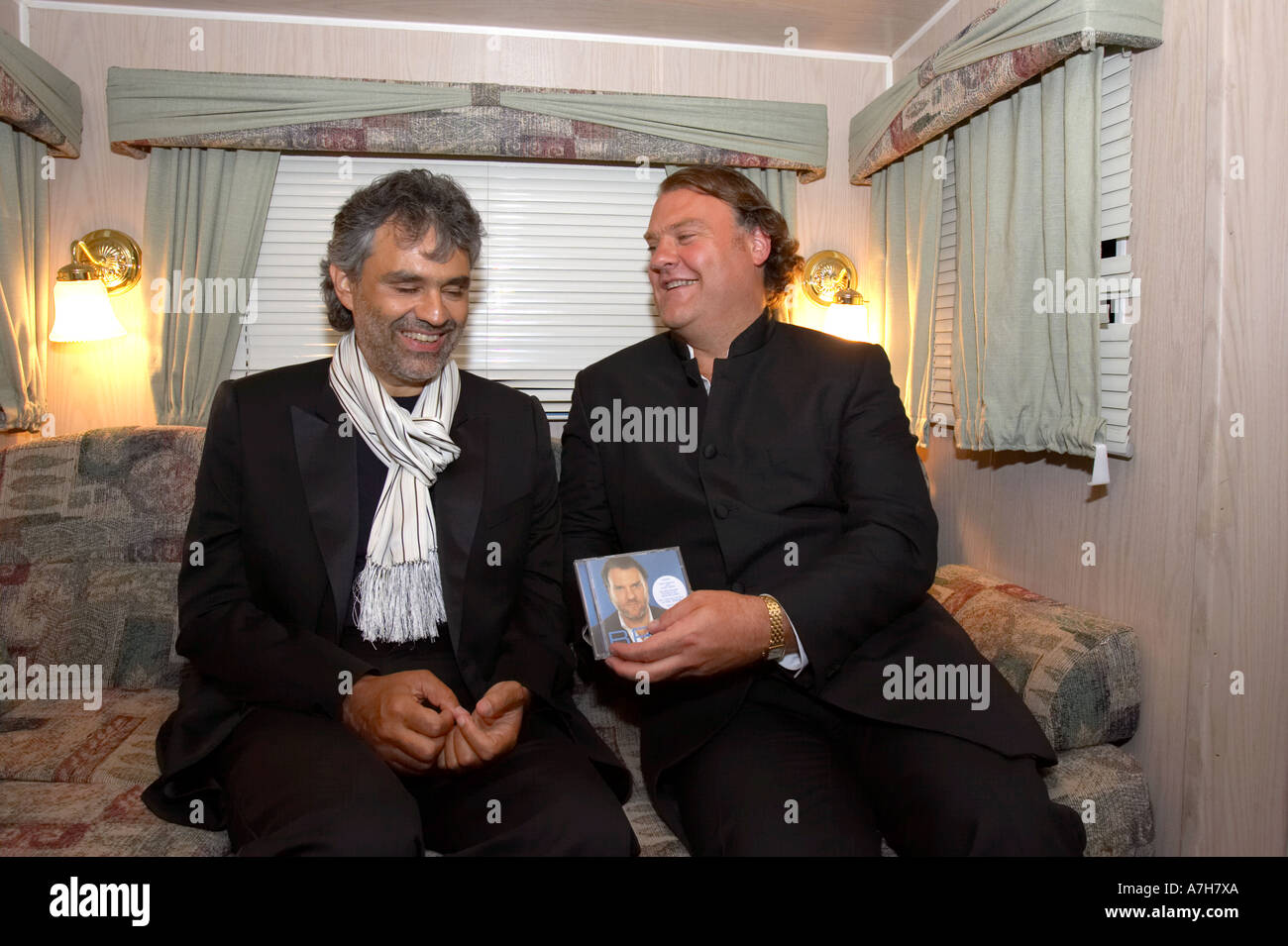 Blind Italian tenor Andrea Bocelli hands Welsh bass baritone Bryn Terfel a copy of Bryns new CD ...