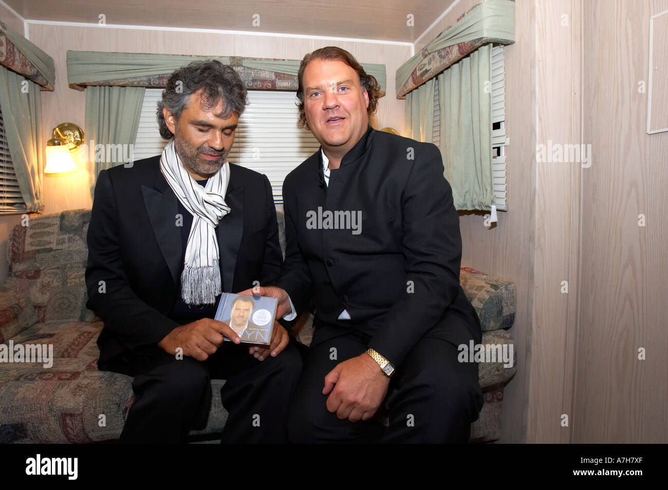 Blind Italian tenor Andrea Bocelli hands Welsh bass baritone Bryn Terfel a copy of Bryns new CD ...