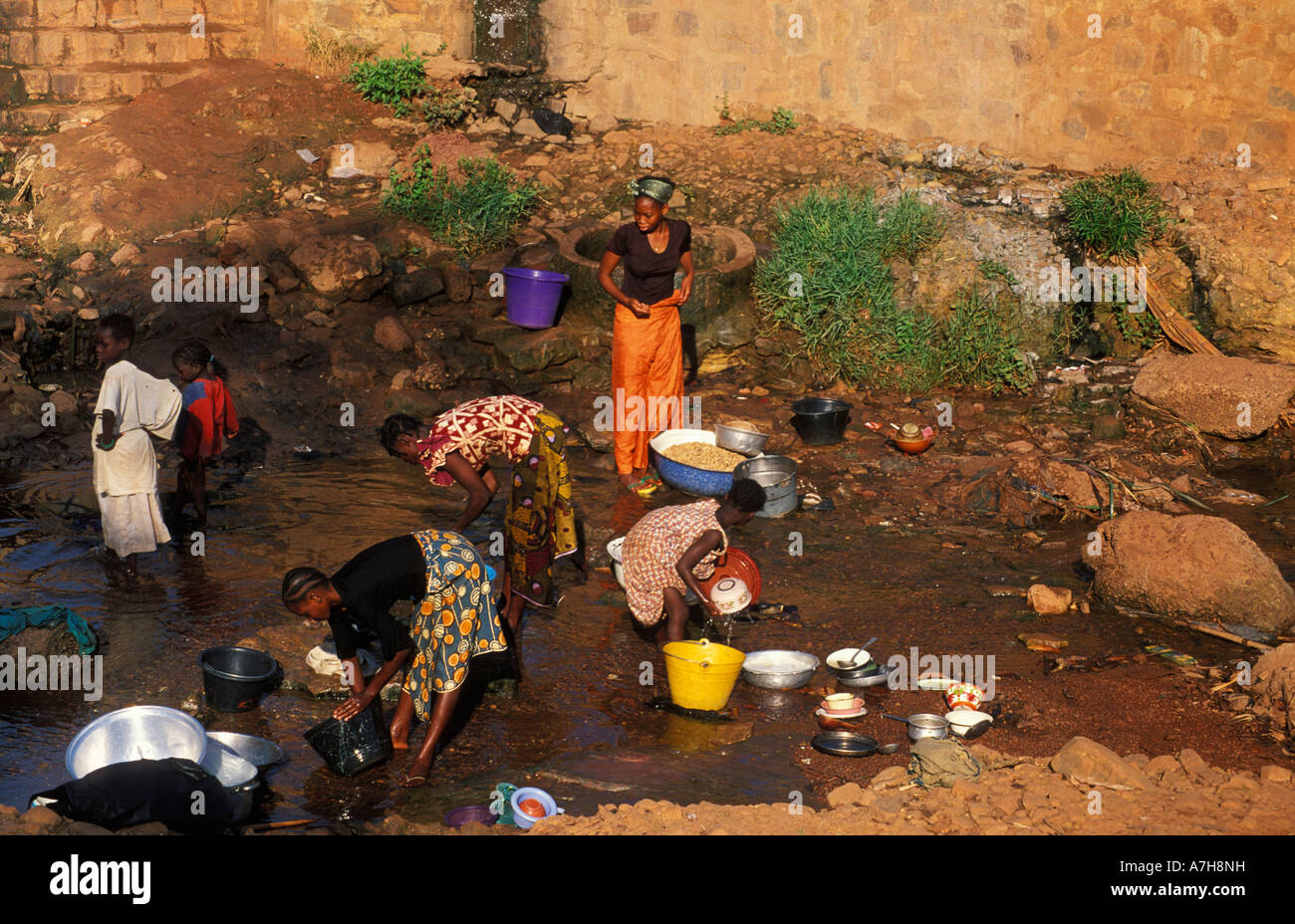 African women wash in river hi-res stock photography and images - Alamy