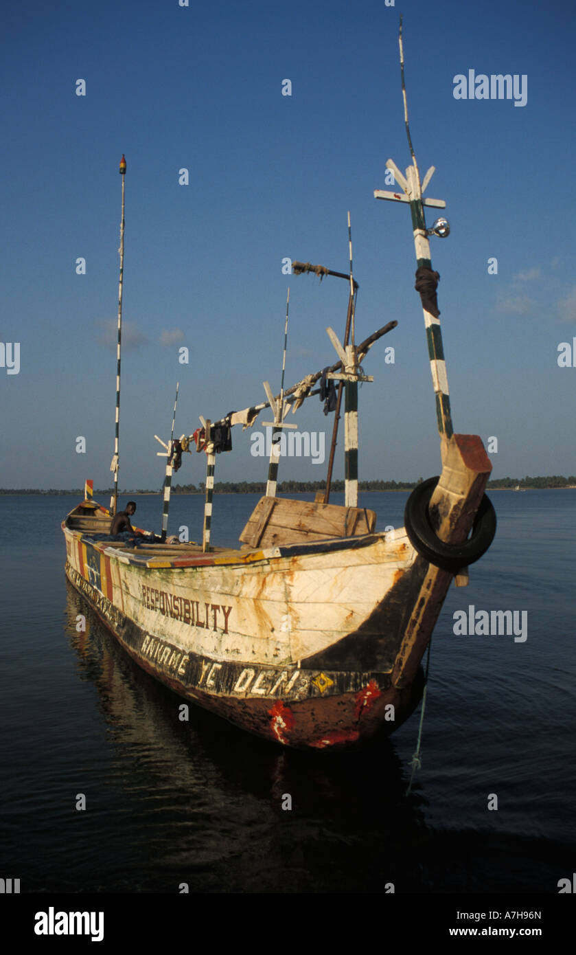 colourful pirogue at the mouth of the Volta river, Volta estuary, Ada ...