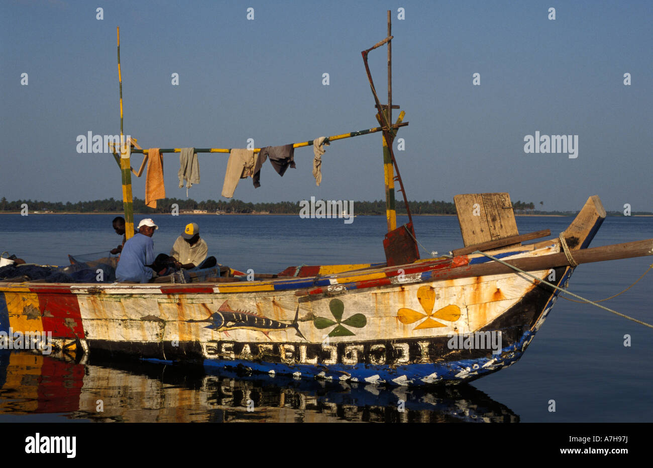colourful pirogue at the mouth of the Volta river, Volta estuary, Ada ...