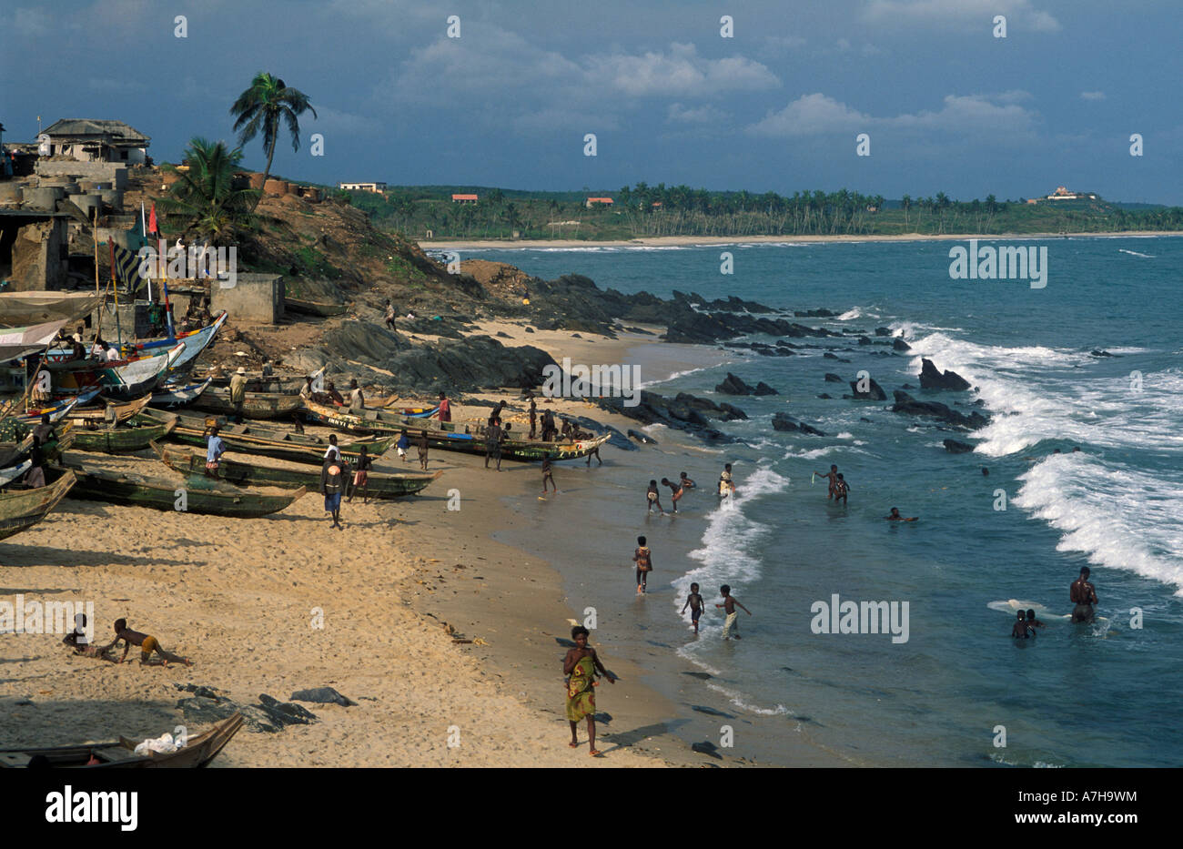 fishing pirogues lying on the beach in the village Biriwa, Ghana Stock ...