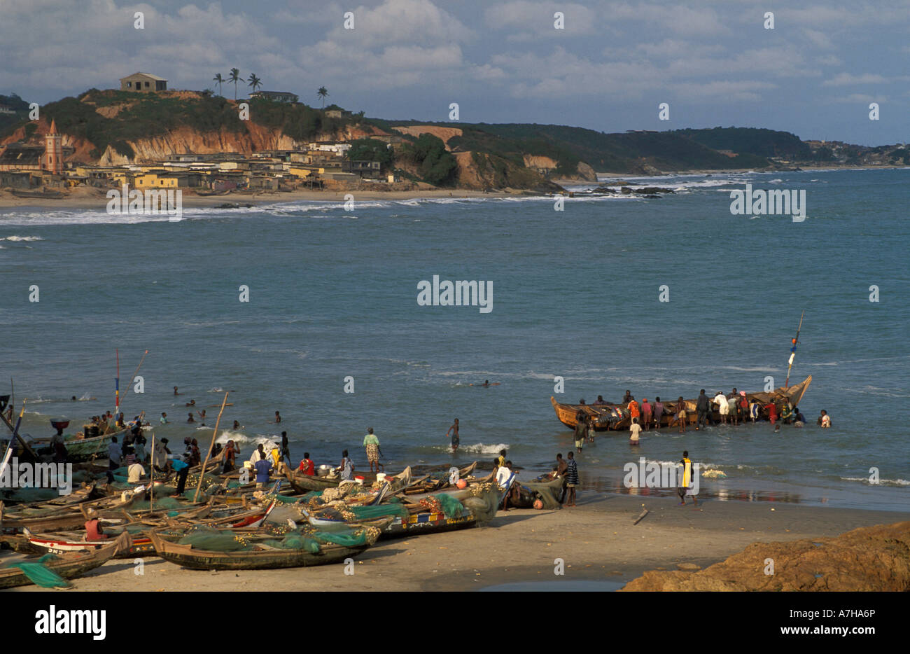 View of the beach and fishing pirogues from Cape Coast Castle, Ghana ...