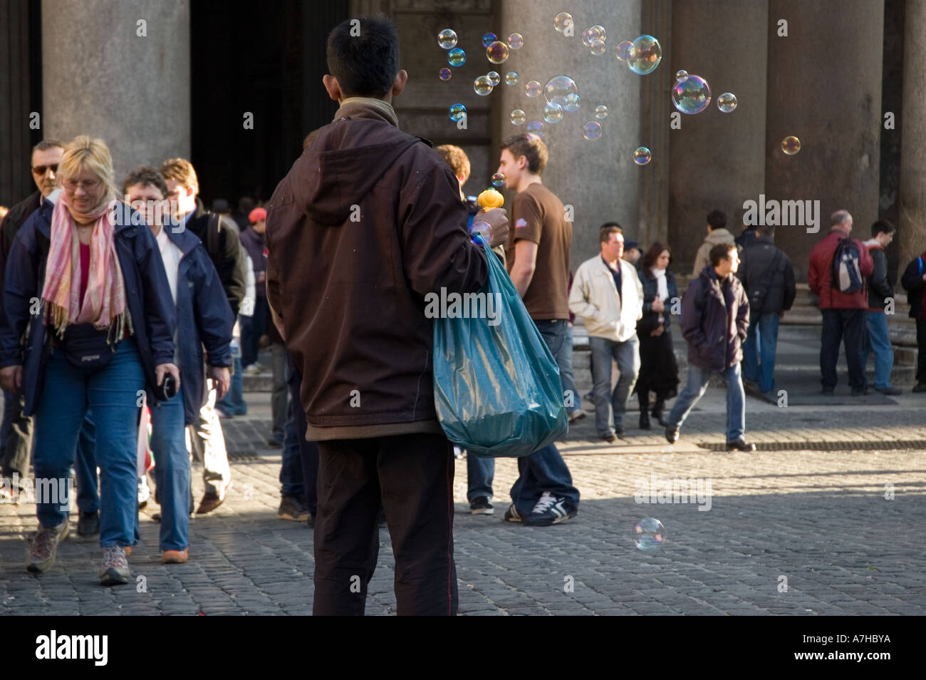 A street peddler outside the Pantheon selling toys to unwary tourists ...