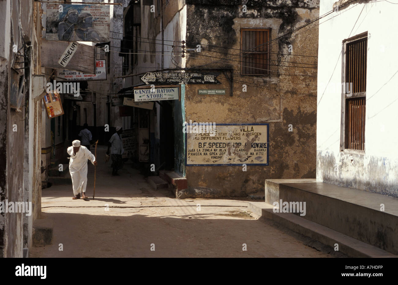 Old man walking in Harambee avenue, the main street in Lamu town, Lamu ...