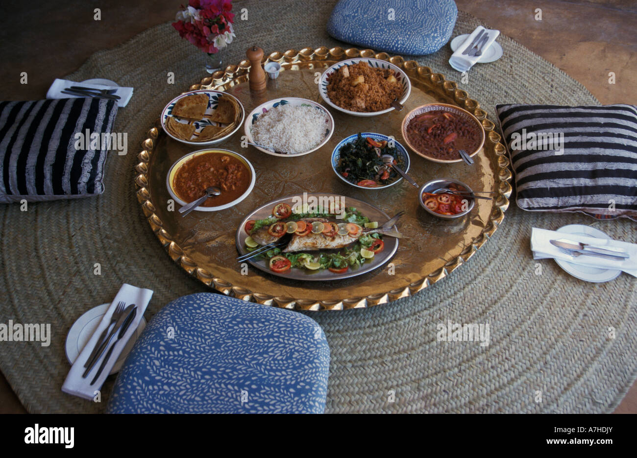 Traditional Swahili food including fish rice curry beans and vegetables ...