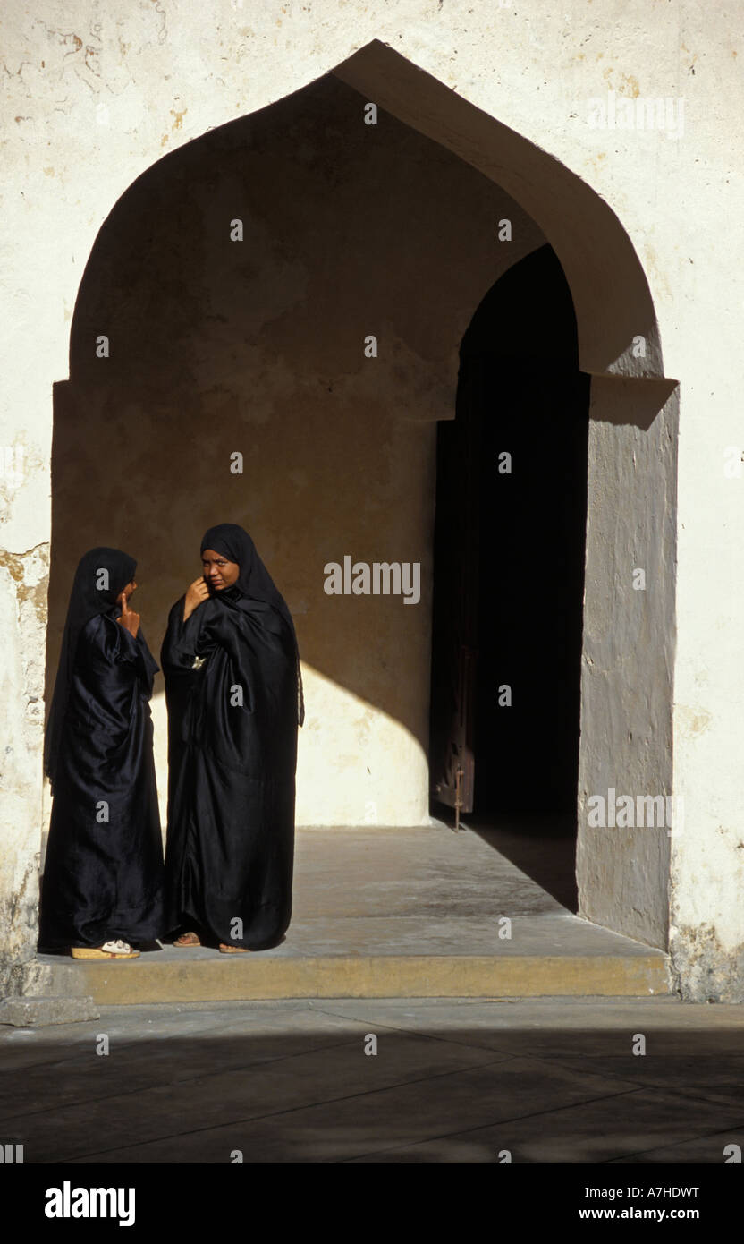 Swahili girls wearing traditional buibui, Arab Fort, Lamu, Kenya Stock ...