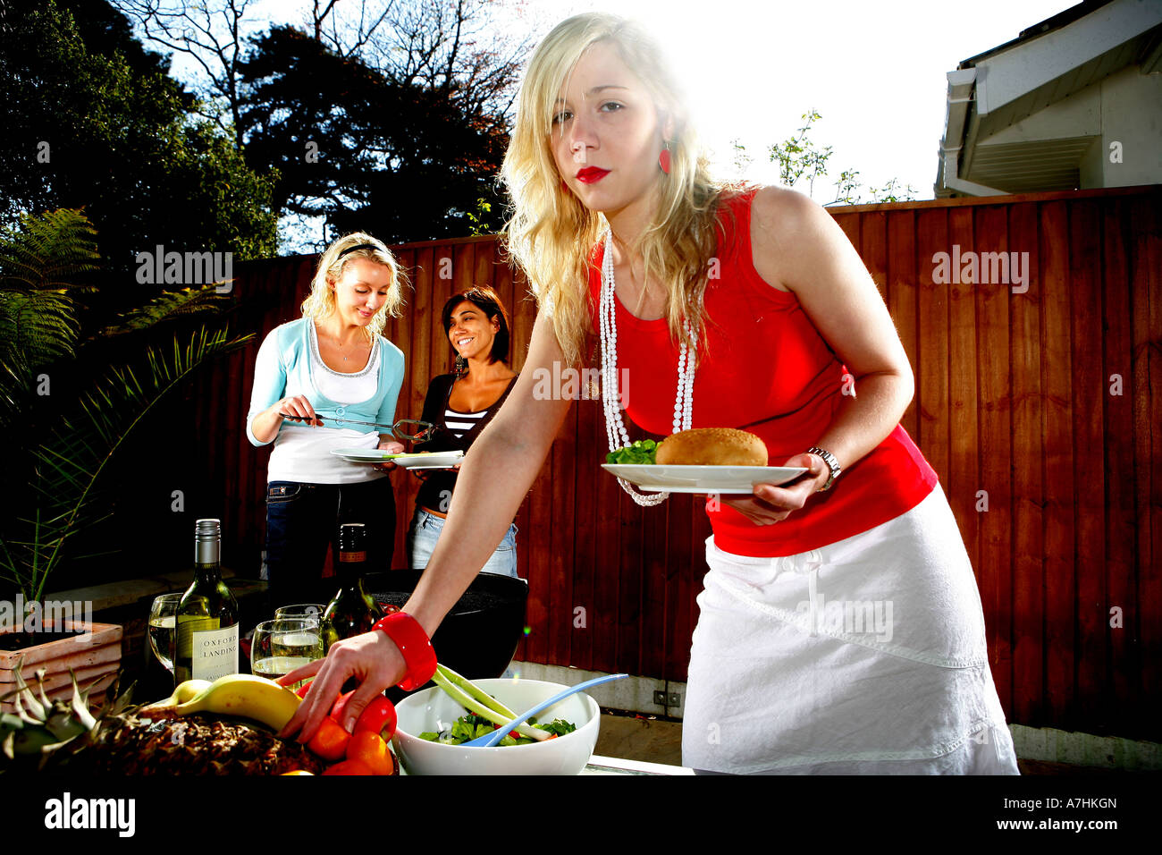 Young Women Having a Barbeque Models Released Stock Photo - Alamy