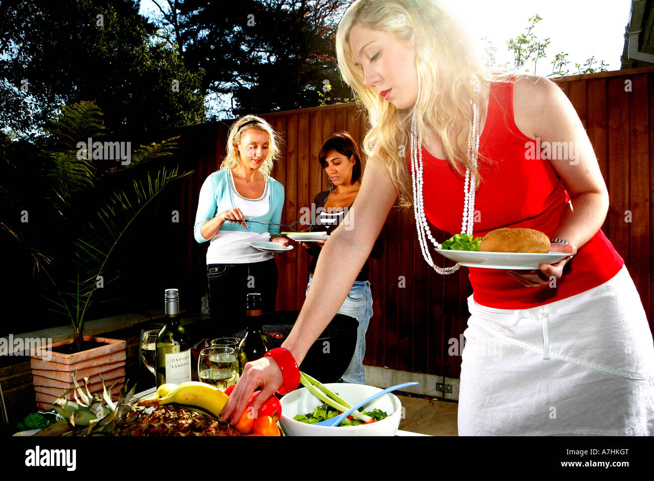 Young Women Having a Barbeque Models Released Stock Photo - Alamy