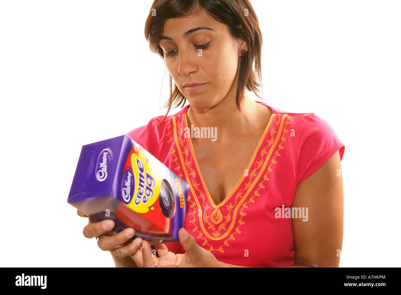 Young Woman Reading Chocolate Egg Label Model Released Stock Photo - Alamy
