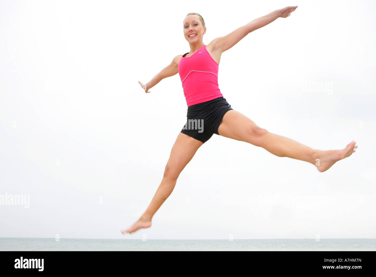 Young Woman Jumping Model Released Stock Photo - Alamy