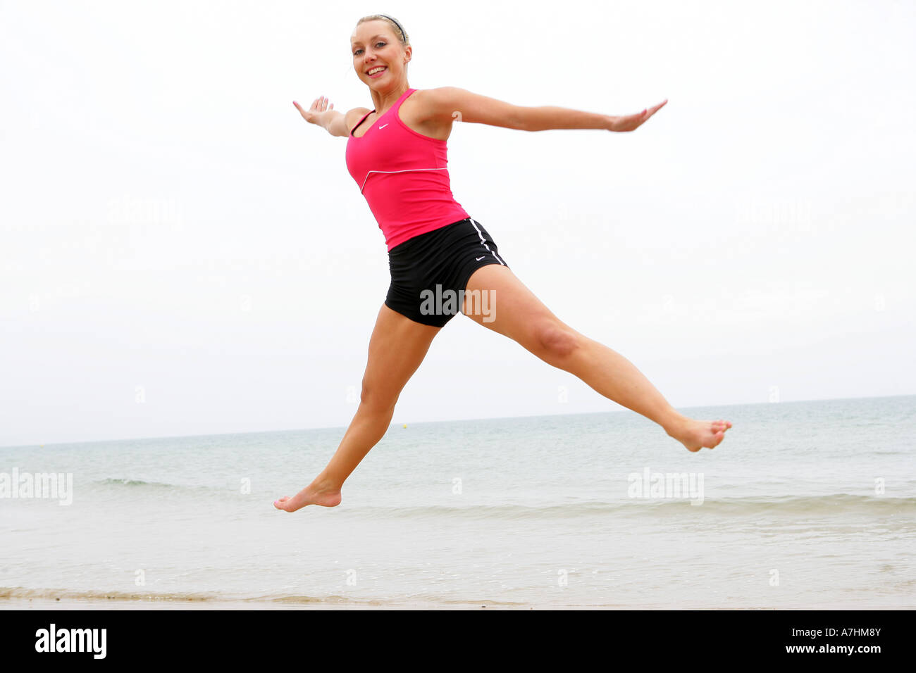 Young Woman Jumping Model Released Stock Photo - Alamy