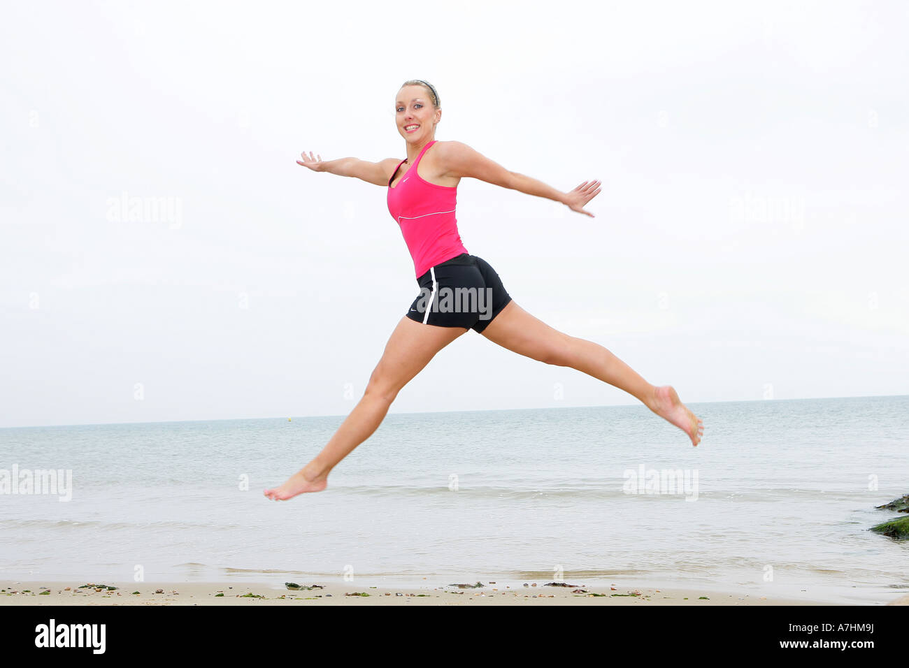 Young Woman Jumping Model Released Stock Photo - Alamy