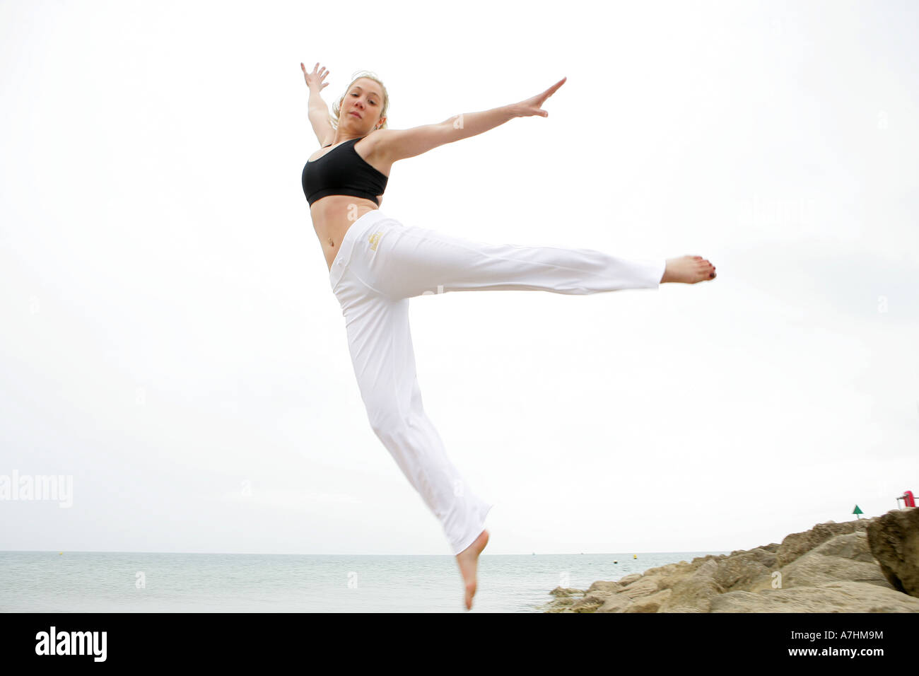 Young Woman Jumping Model Released Stock Photo - Alamy