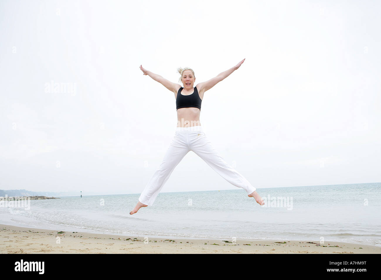 Young Woman Jumping Model Released Stock Photo - Alamy