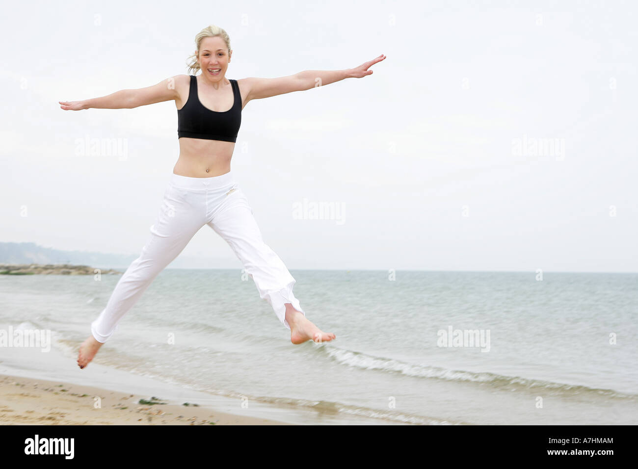 Young Woman Jumping Model Released Stock Photo - Alamy