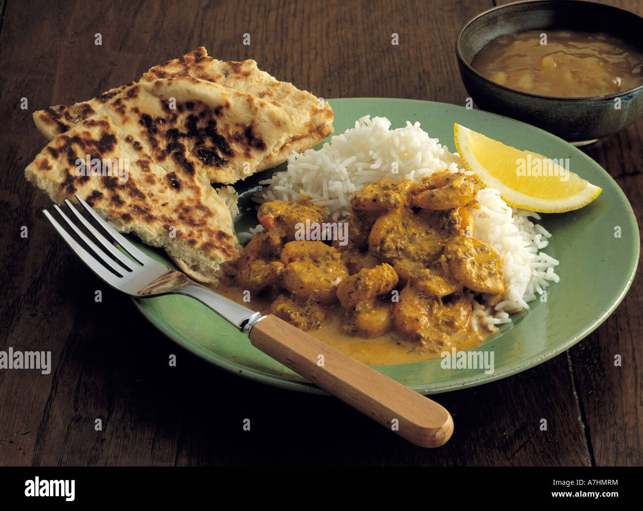 A plate of prawn curry and rice with naan editorial food Stock Photo ...