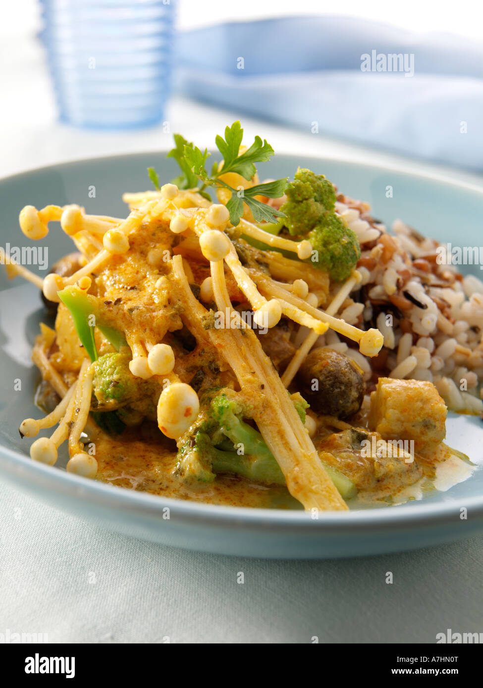 Indian vegetable enoki mushroom curry wild rice hi-res stock ...