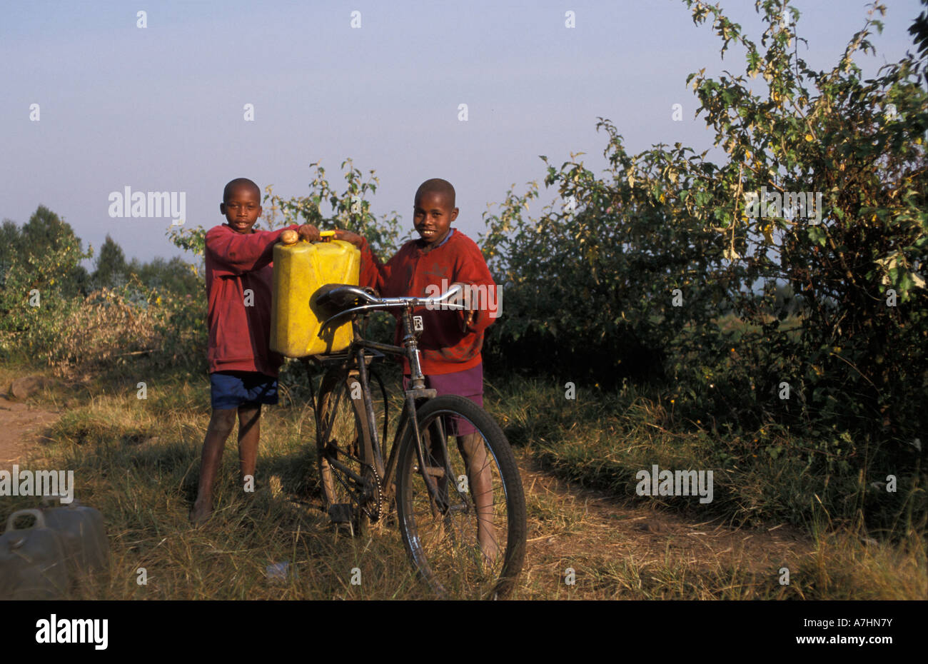 Children fetching water from a river, Musanze, Rwanda Stock Photo - Alamy