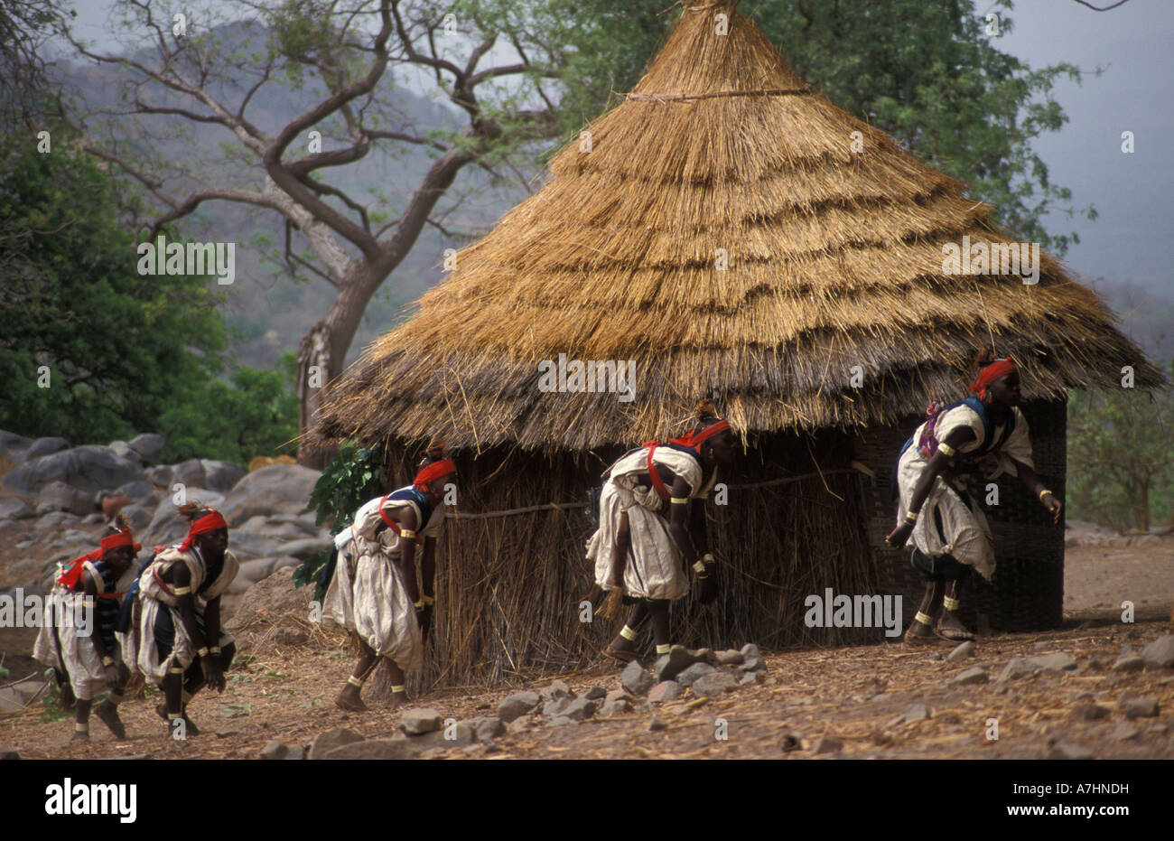 Initiation ceremony boys dancing around a hut which contains the ...