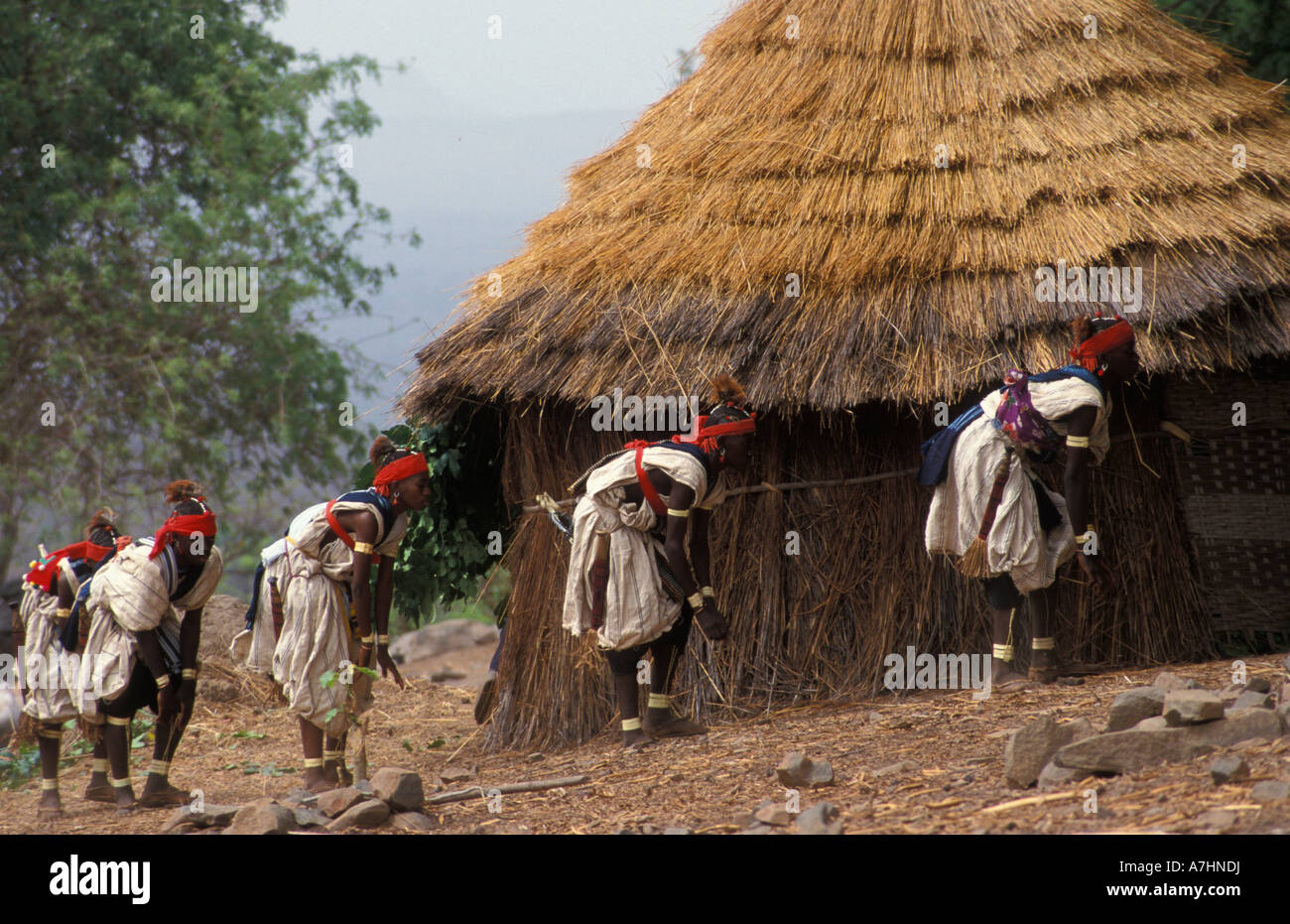 Initiation ceremony boys dancing around a hut which contains the ...