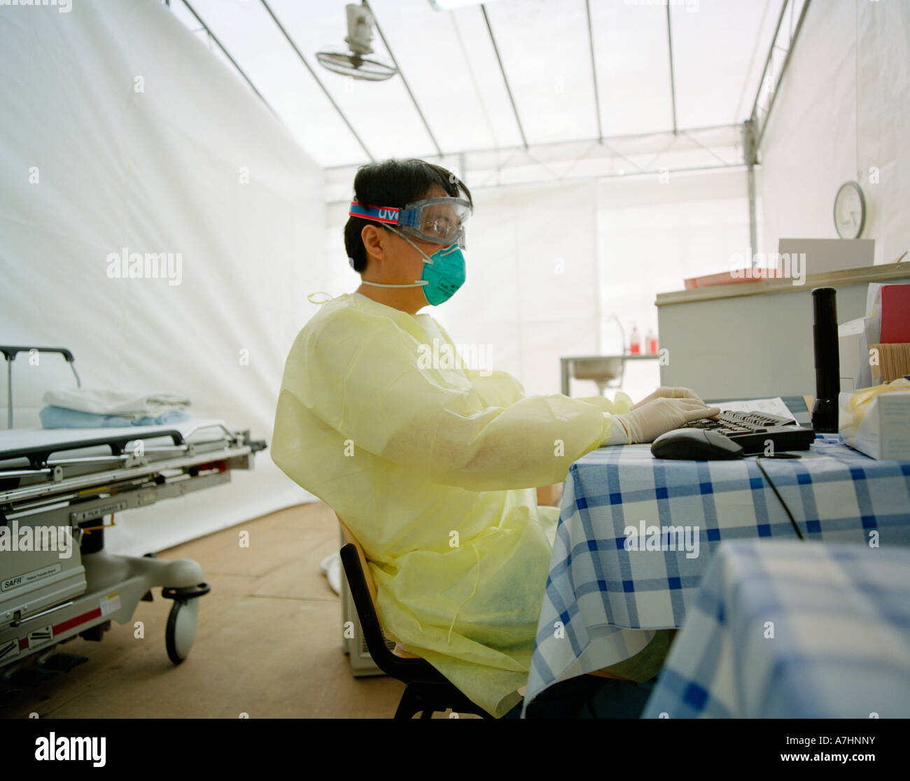 Doctors work in a temporary outdoor clinic set up during the SARS ...