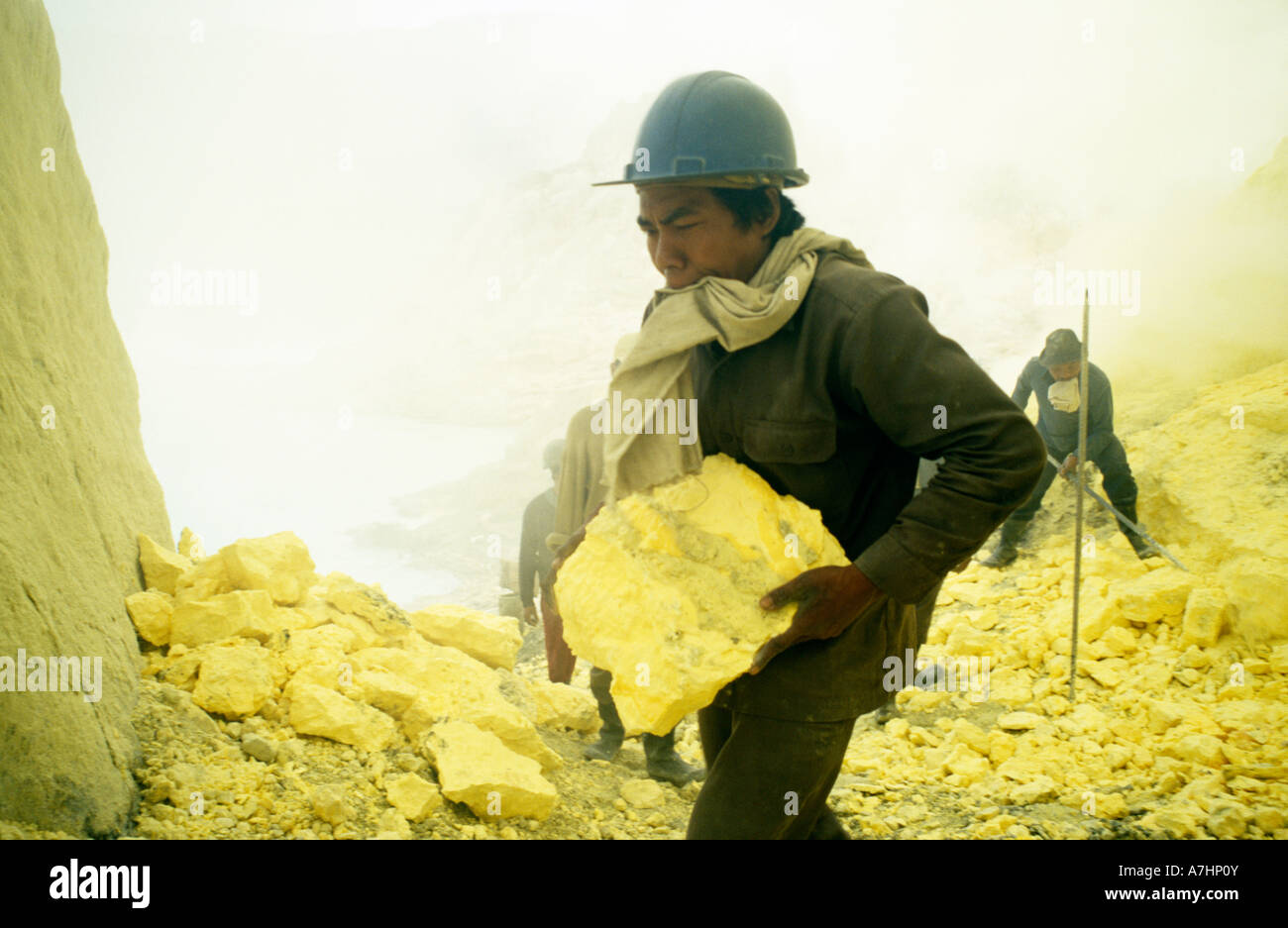 Sulfur miners in Indonesia Stock Photo - Alamy