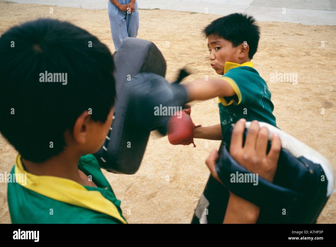 Chinese boys practicing punching at the Ta Gou Academy Stock Photo - Alamy