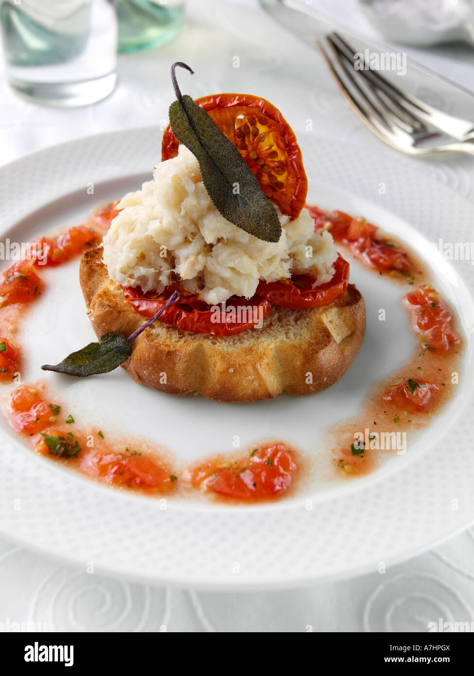 Brandade of salted cod on a slice of brioche in a restaurant table ...