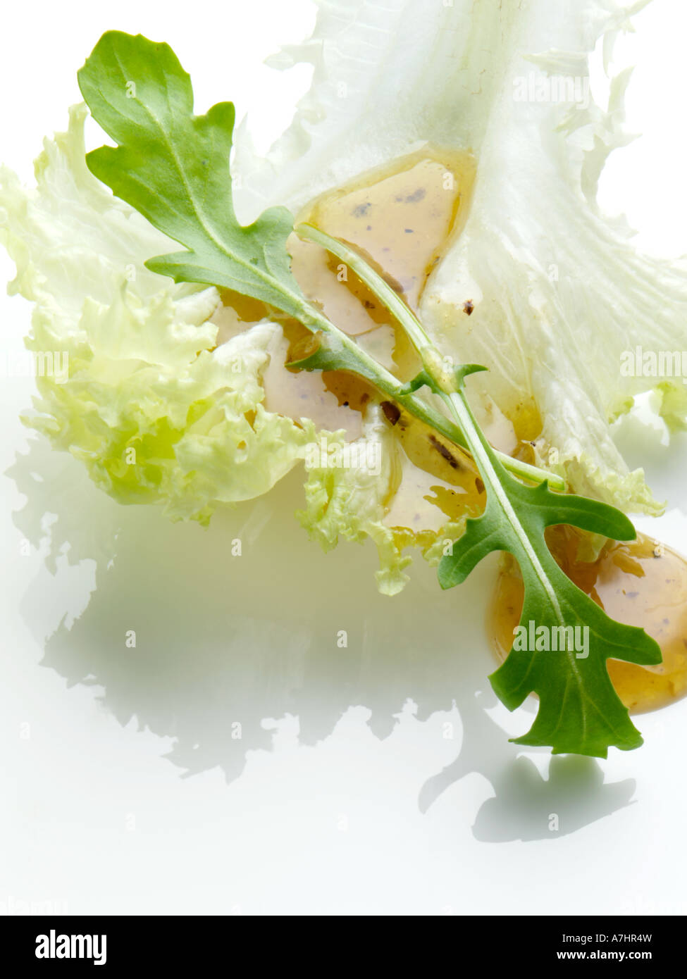 Lettuce leaf rocket and salad dressing editorial food Stock Photo - Alamy