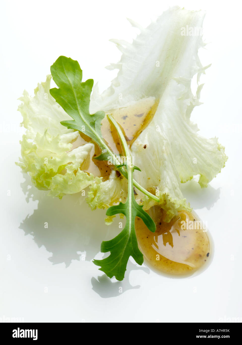 Lettuce leaf rocket and salad dressing editorial food Stock Photo - Alamy