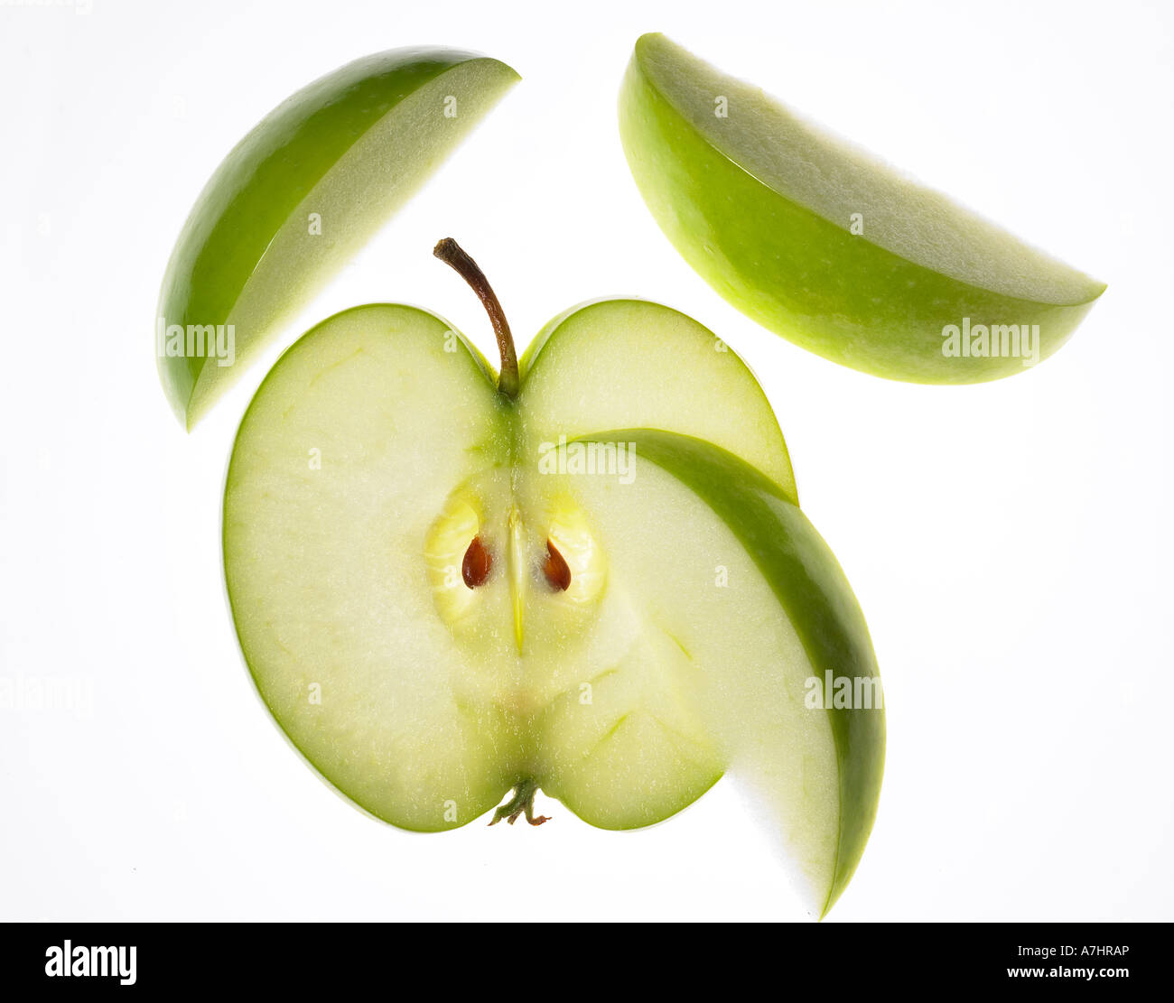 sliced green apples on white background Stock Photo - Alamy