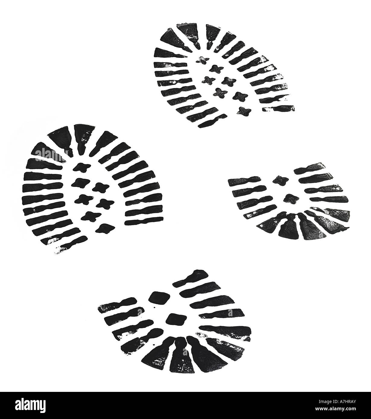 two boot prints at an angle on white background Stock Photo - Alamy