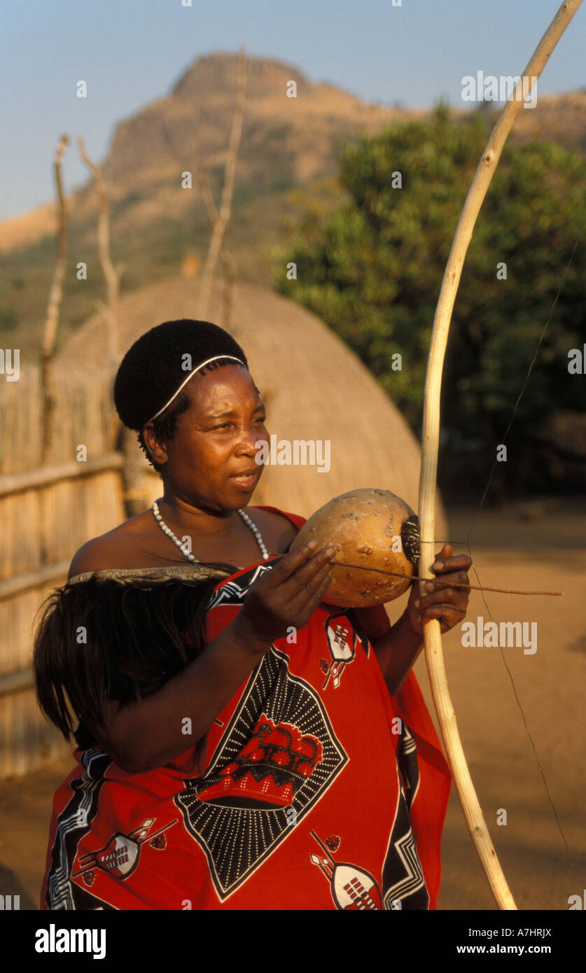 Swazi woman playing the Makhoyane or Swazi guitar Mantenga village ...
