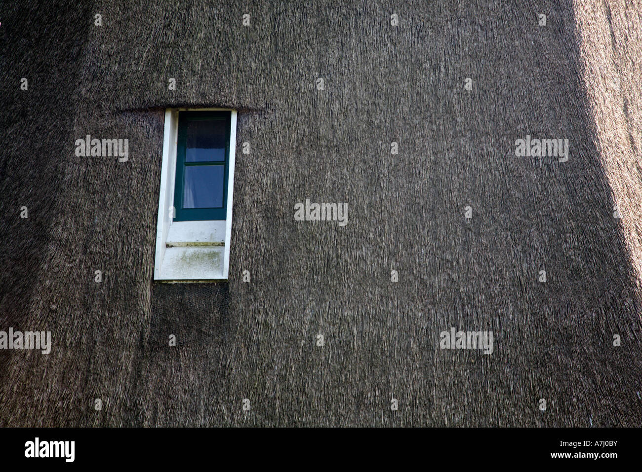 Window in thatched roof of windmill, Streefkerk, Holland Stock Photo ...