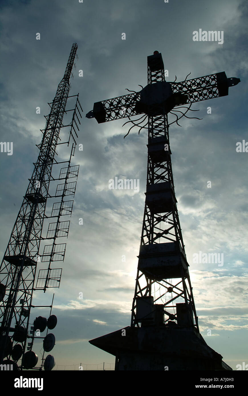 Huge metal cross next to communication towers on the Fasce mountain ...