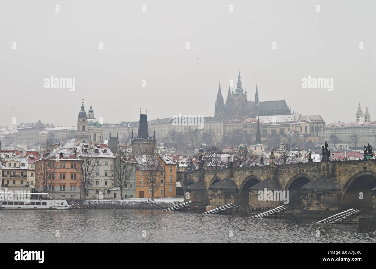 river vltava snow winter charles bridge prague mist misty foggy day ...