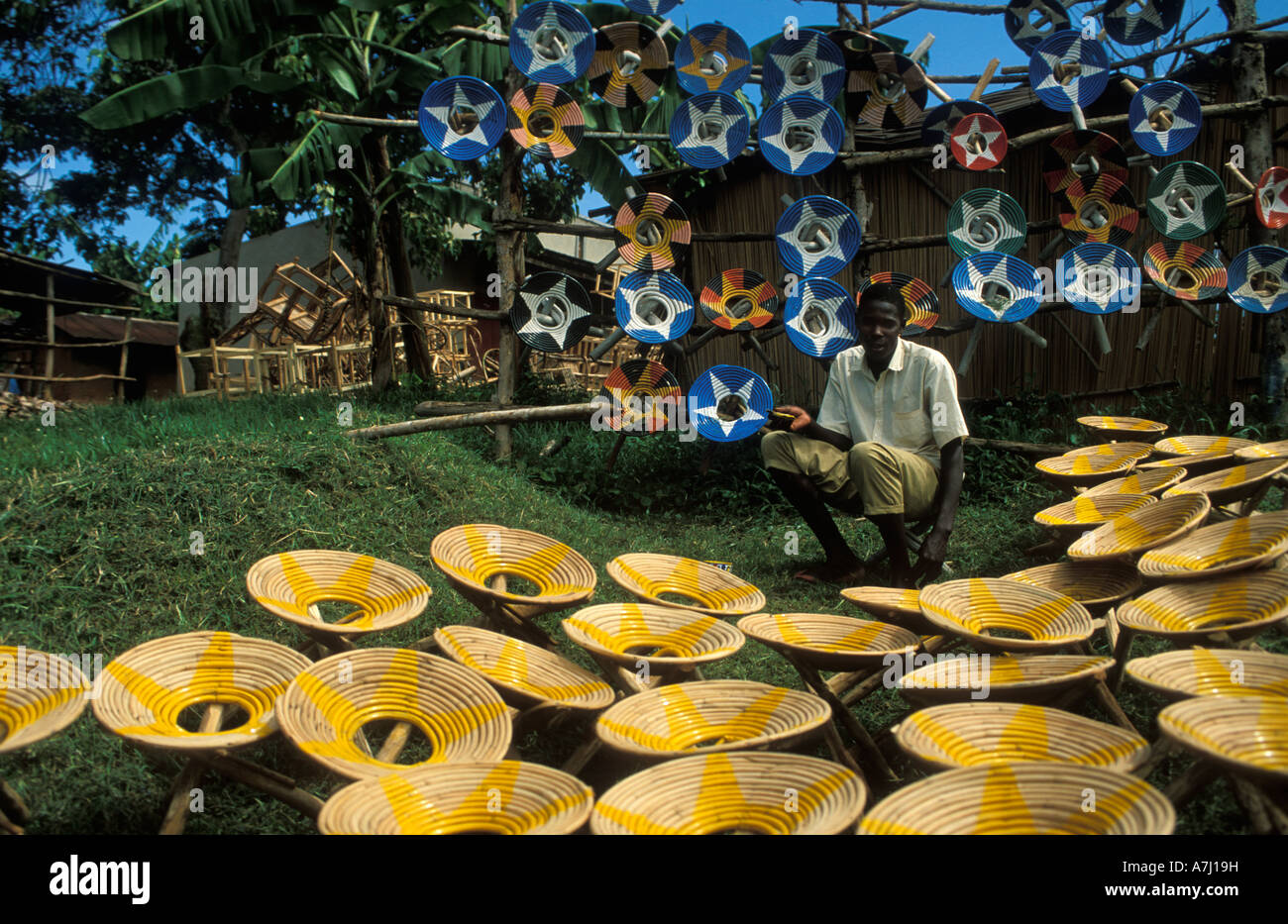 Roadside store on the Kampala Masaka road selling colourful stools ...