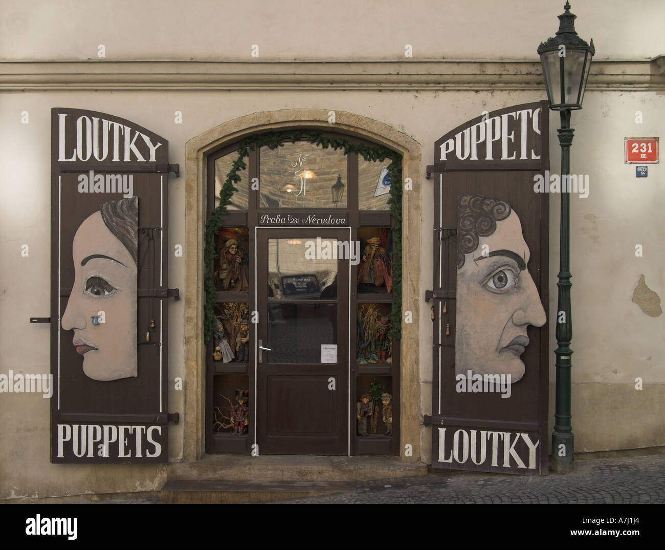 Door of Loutky puppet shop Prague decorated with caricature of Franz ...