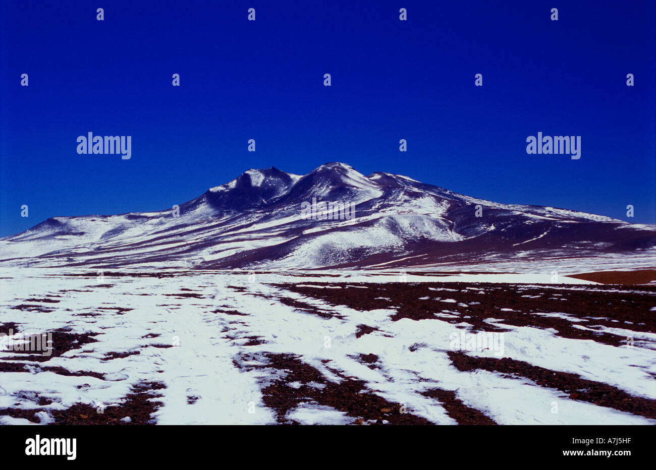 Snow covered mountains in Siloli desert in Bolivia Stock Photo - Alamy