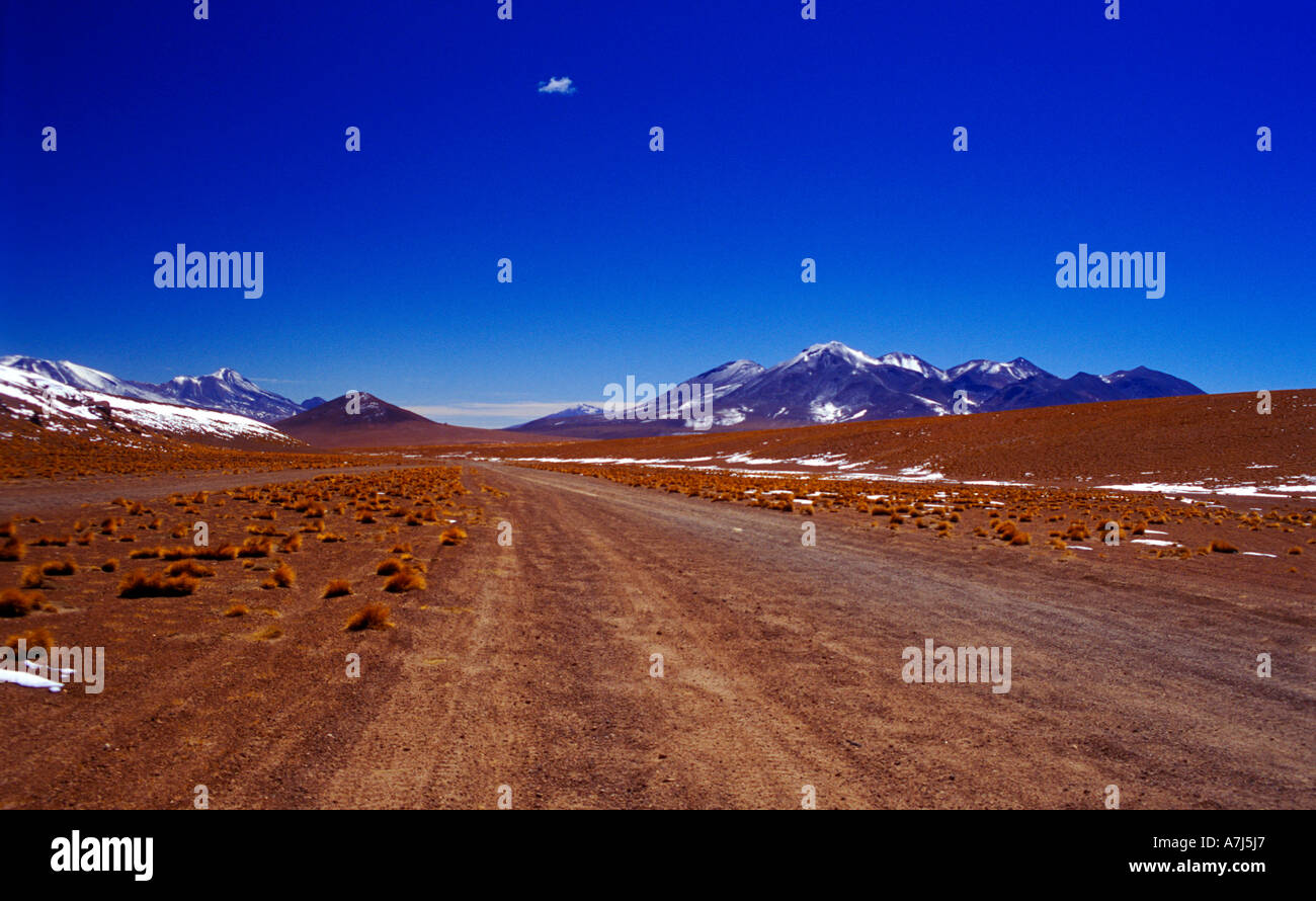 Snow covered mountains in Siloli desert in Bolivia Stock Photo - Alamy