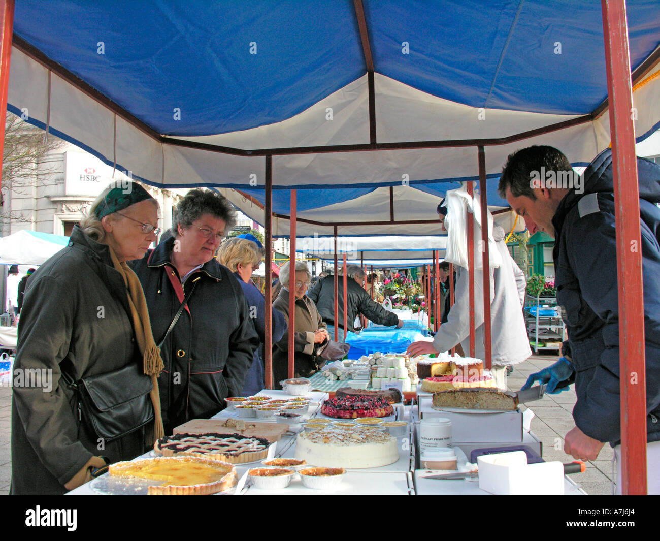 people looking at cakes and delicacies stall Farmers Market Worthing ...