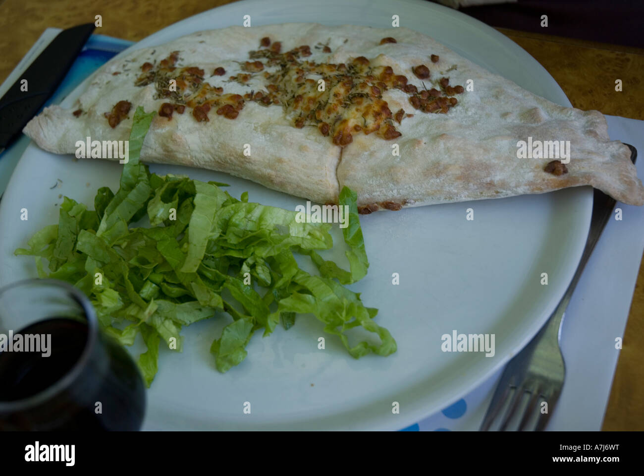 Calzone pizza in a French restuarant Stock Photo - Alamy