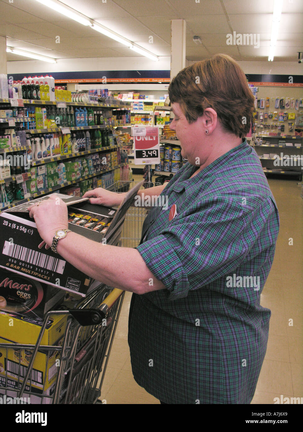 shop assistant working in a local convenience store Stock Photo - Alamy