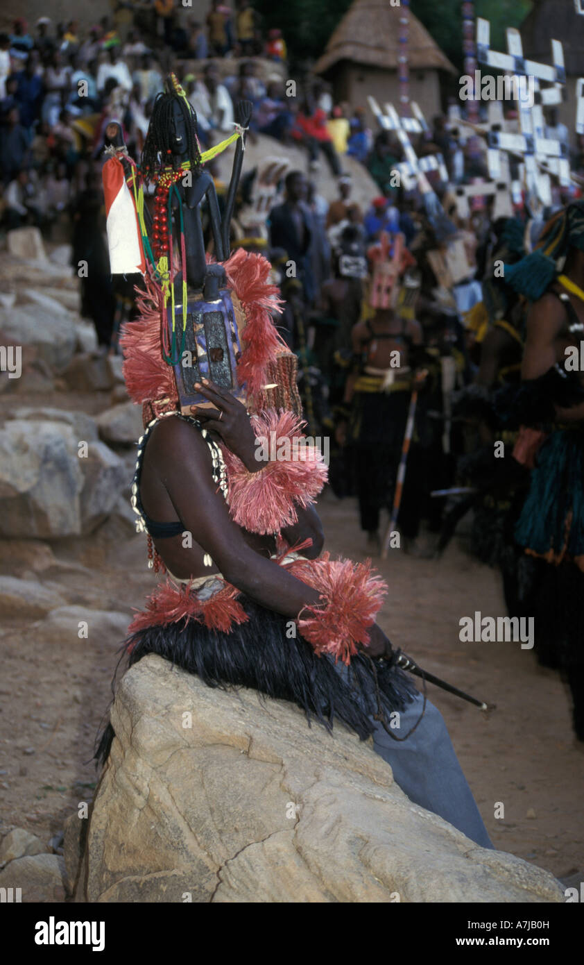 Masked dancer at the Dama festival, Ireli village below the Bandiagara ...