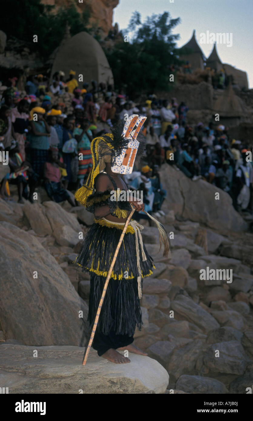 Masked dancer at the Dama festival, Ireli village below the Bandiagara ...