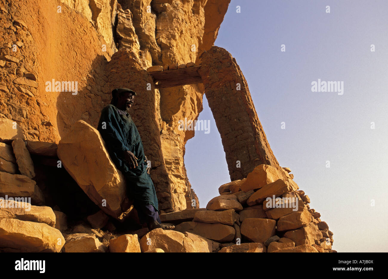 Hogon, spiritual leader in his carved cliff home, Ende village, Dogon ...
